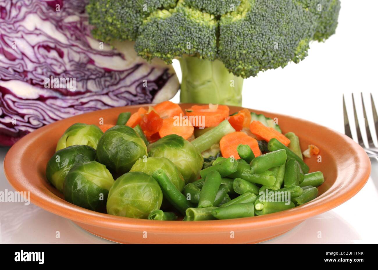 Mixed vegetables on plate close-up isolated on white Stock Photo - Alamy