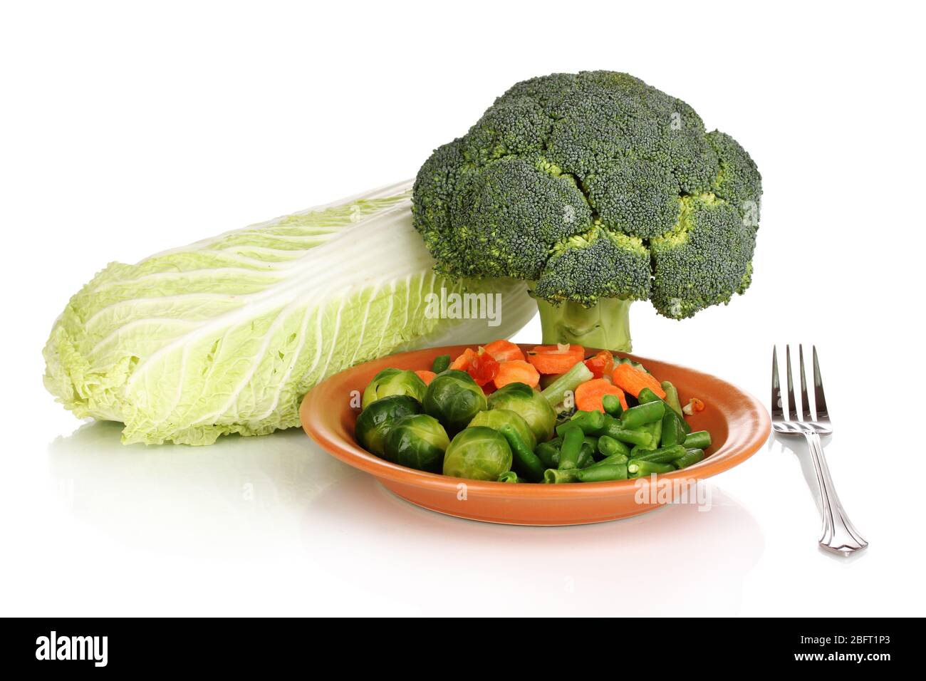 Mixed vegetables on plate isolated on white Stock Photo - Alamy