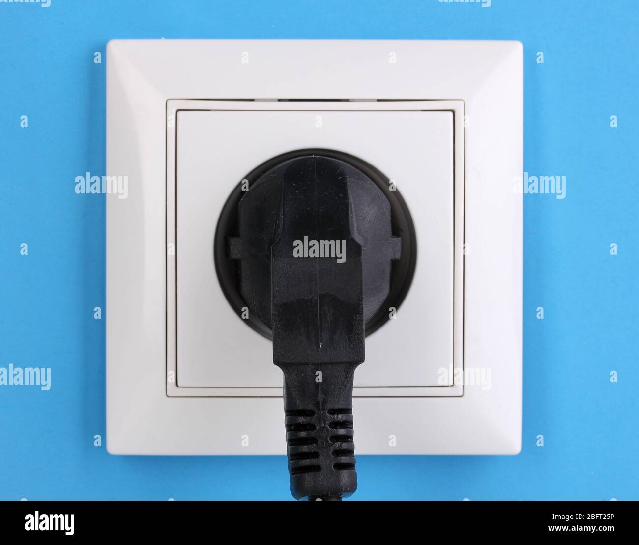 White electric socket with plug on the wall Stock Photo - Alamy