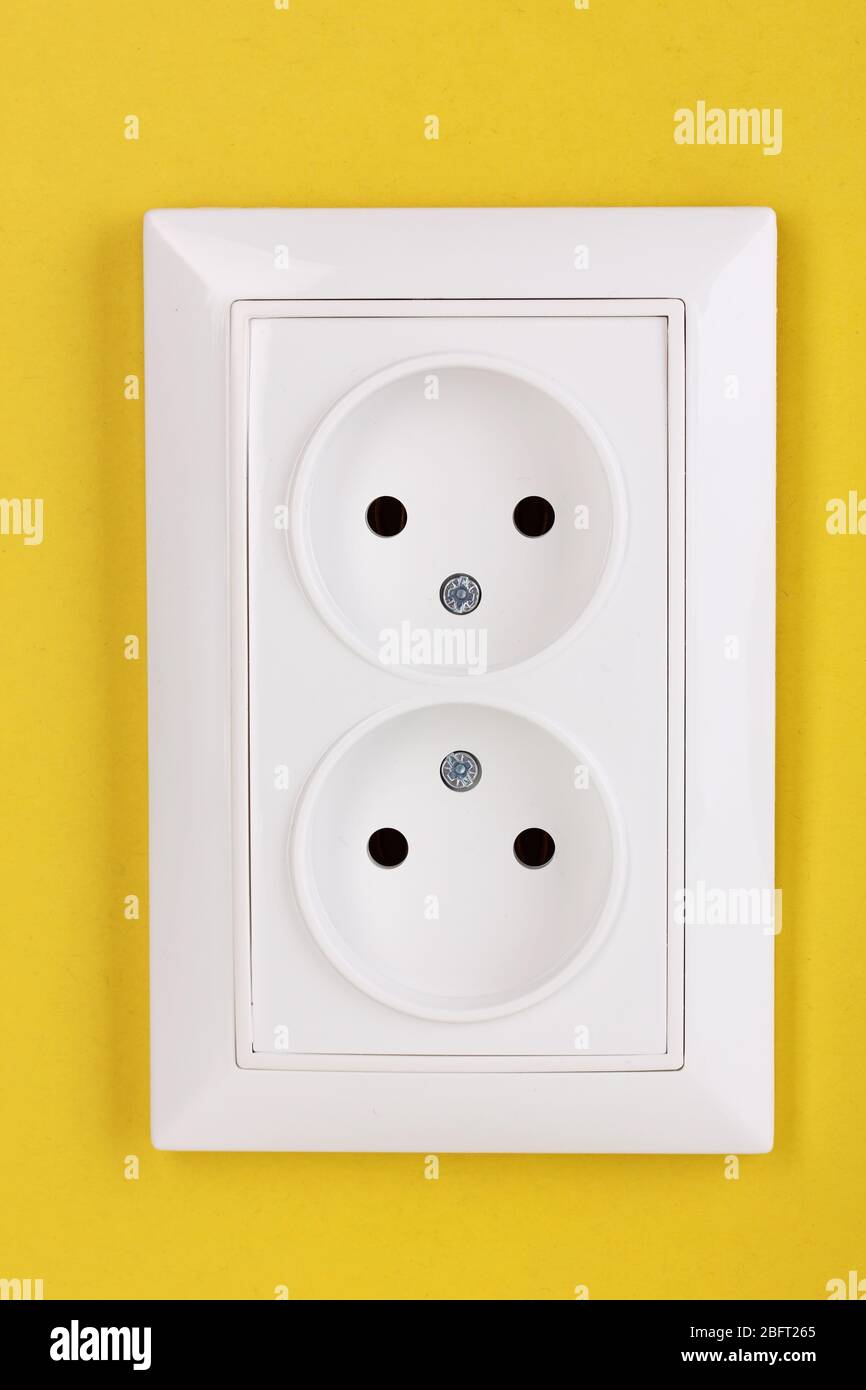 White electric socket on the wall Stock Photo - Alamy