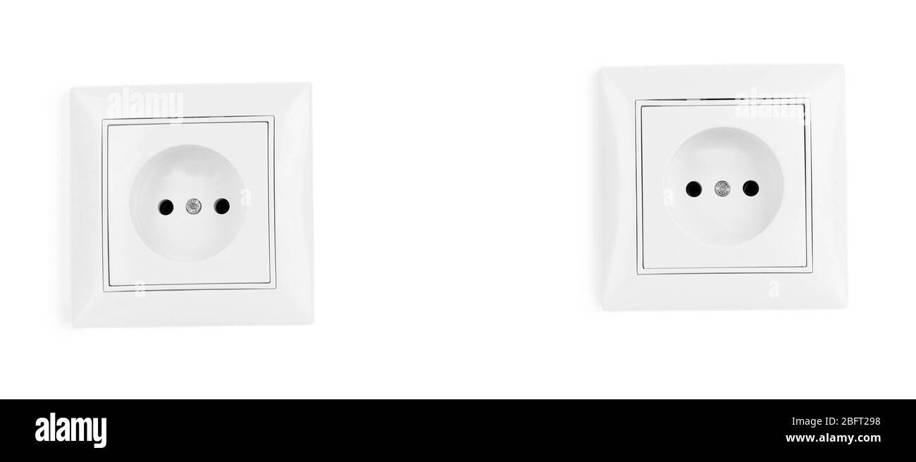 White electric sockets on the wall Stock Photo - Alamy
