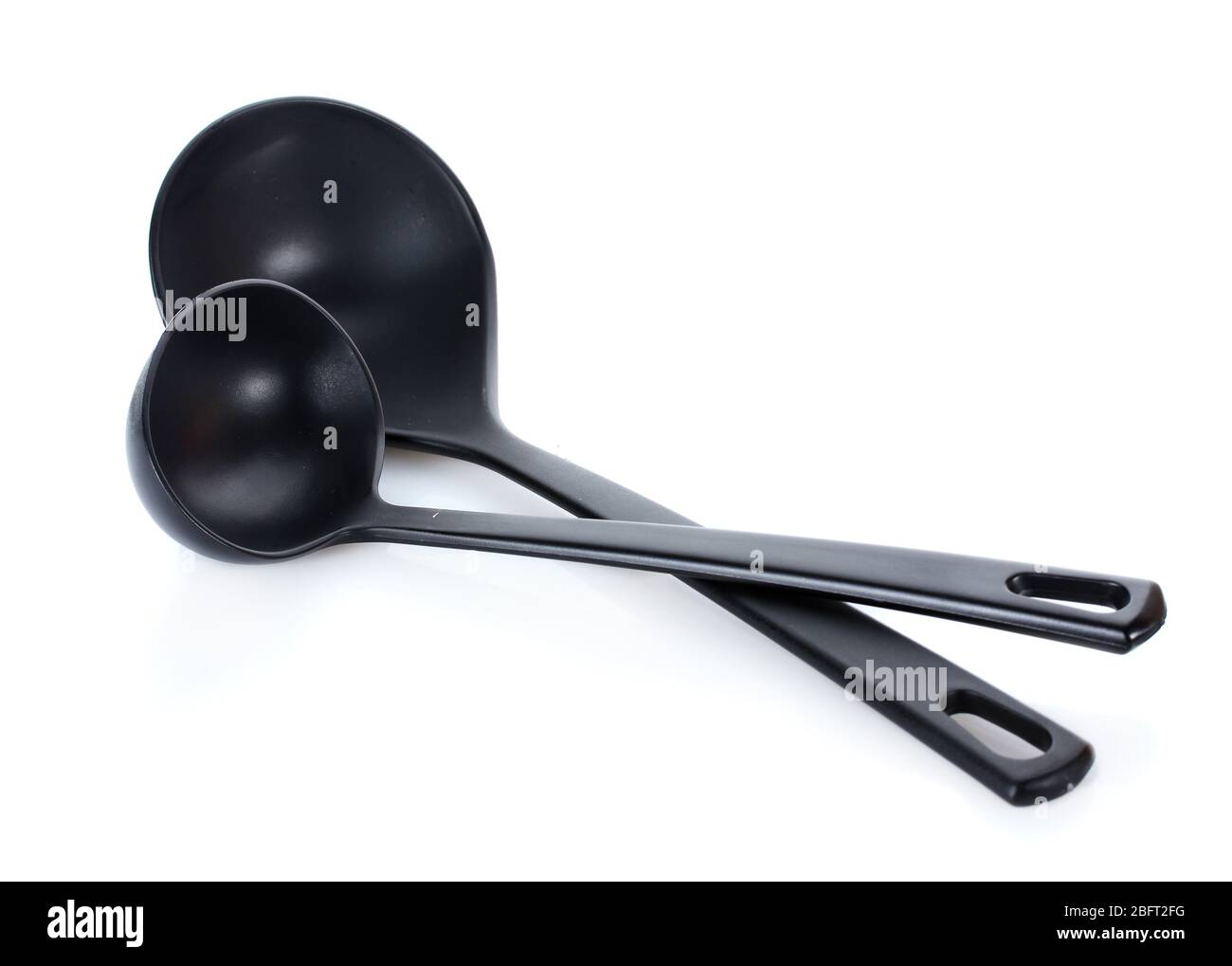 black kitchen ladles isolated on white Stock Photo - Alamy