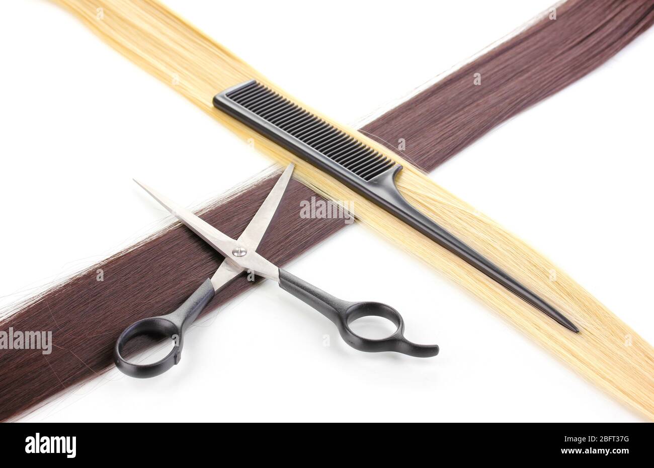 Shiny blond and brown hair with hair cutting shears and comb isolated ...