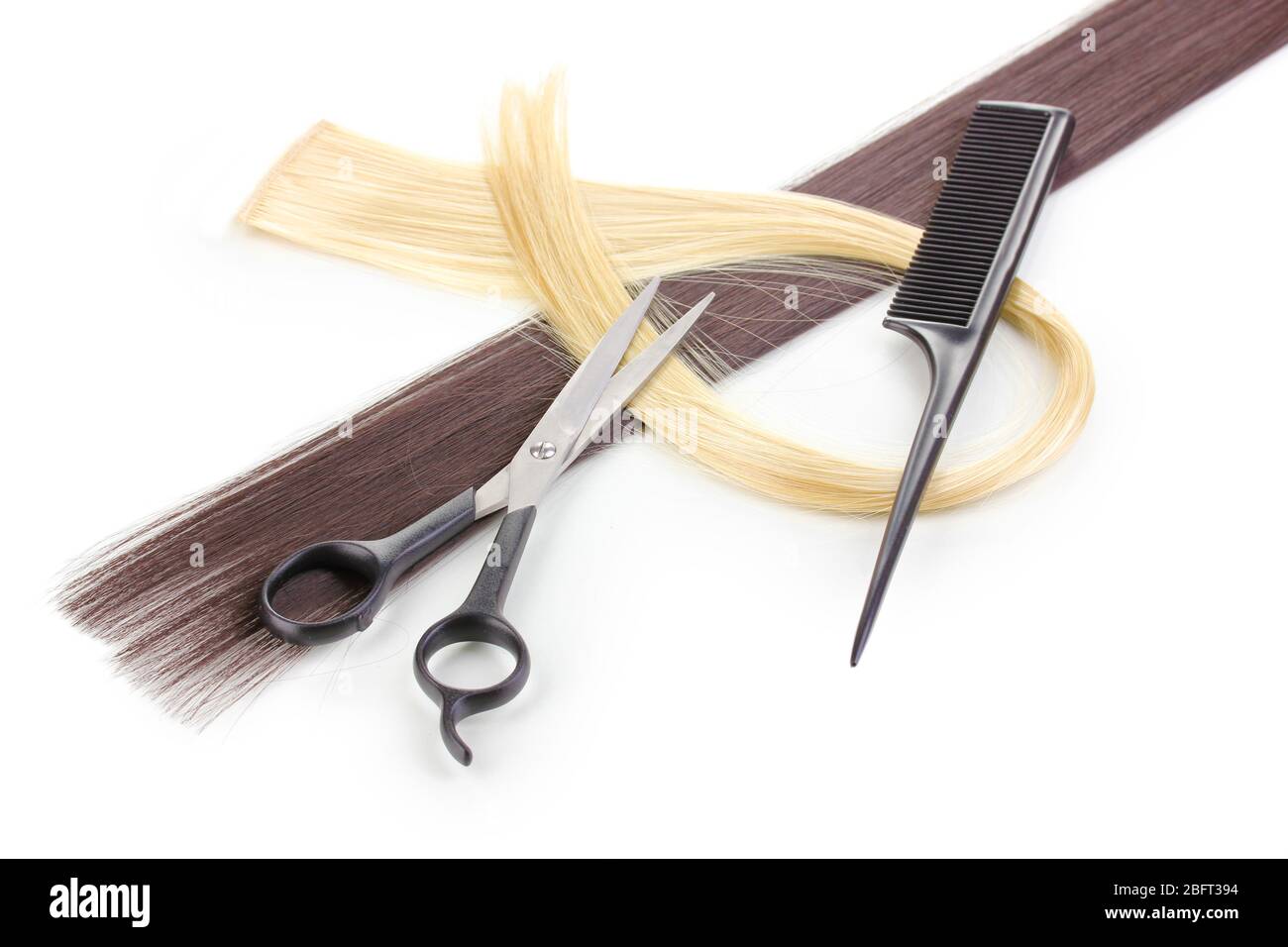Shiny blond and brown hair with hair cutting shears and comb isolated ...