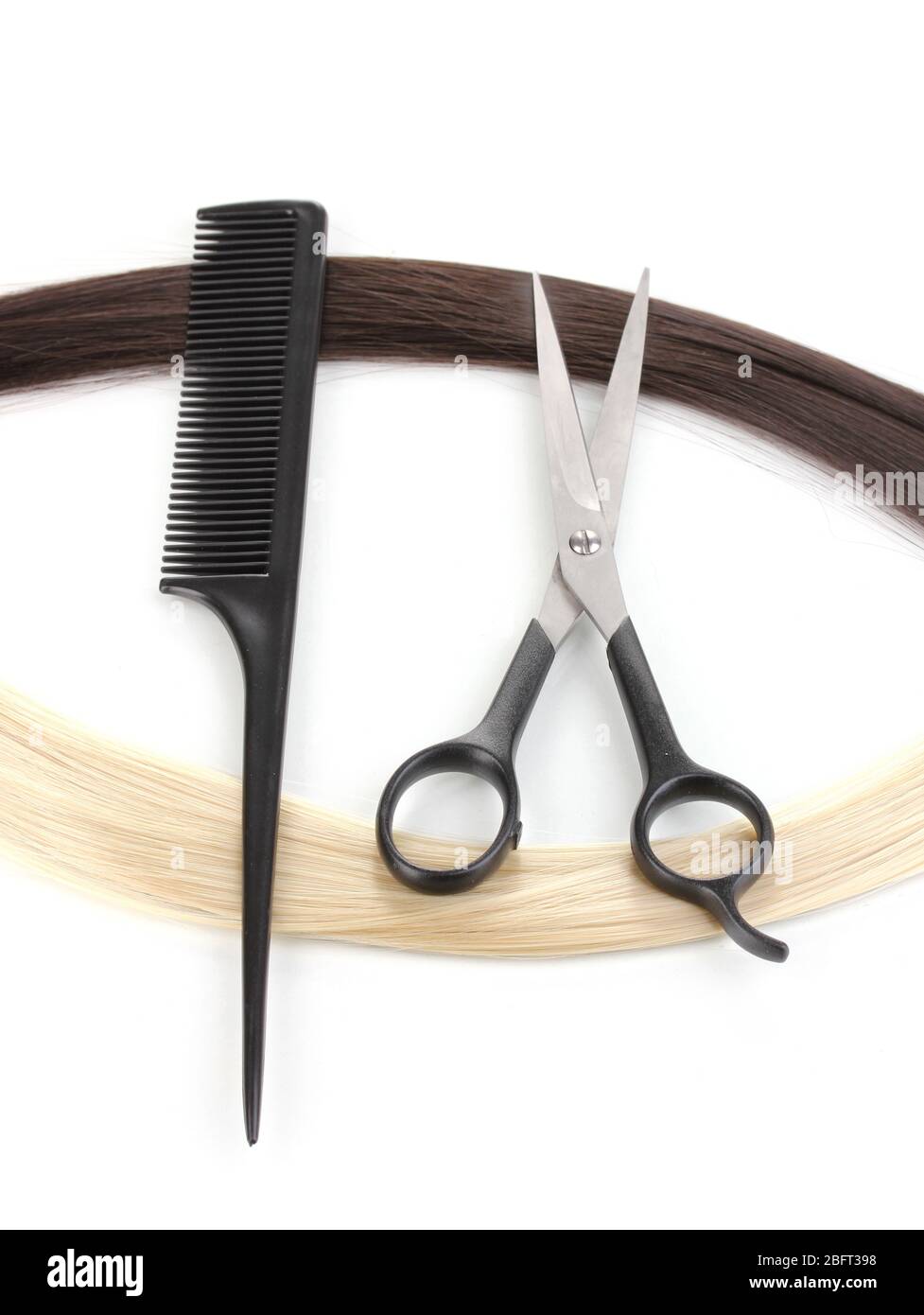 Shiny blond and brown hair with hair cutting shears and comb isolated ...