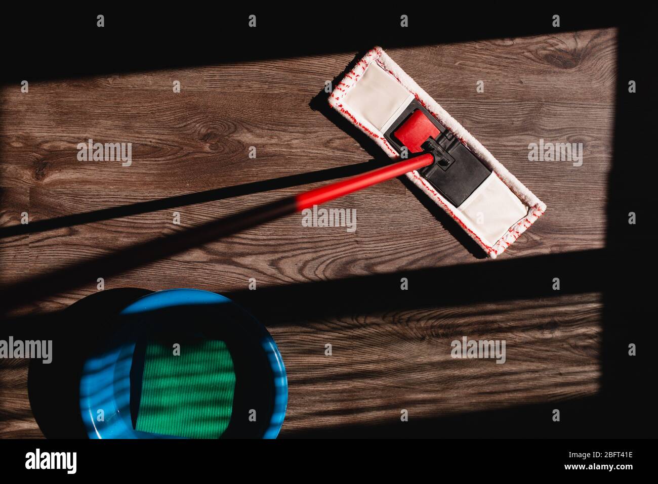 Blue water basin and floor mop Stock Photo - Alamy