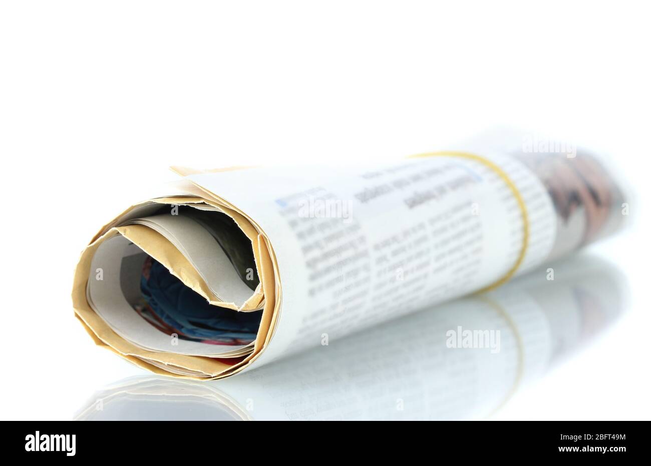 Roll of newspaper isolated on white Stock Photo - Alamy