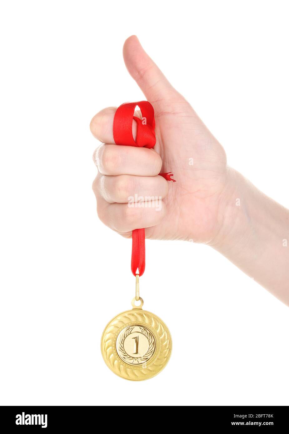 Gold medal in hand isolated on white Stock Photo - Alamy