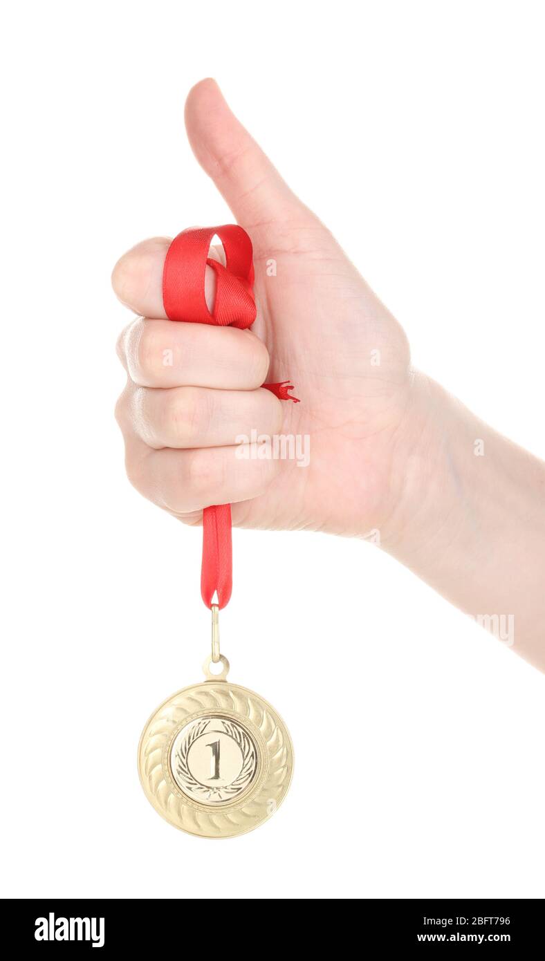 Gold medal in hand isolated on white Stock Photo - Alamy