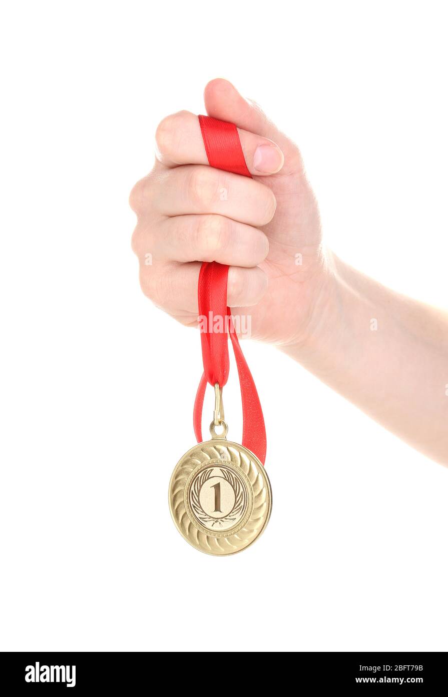 Gold medal in hand isolated on white Stock Photo - Alamy