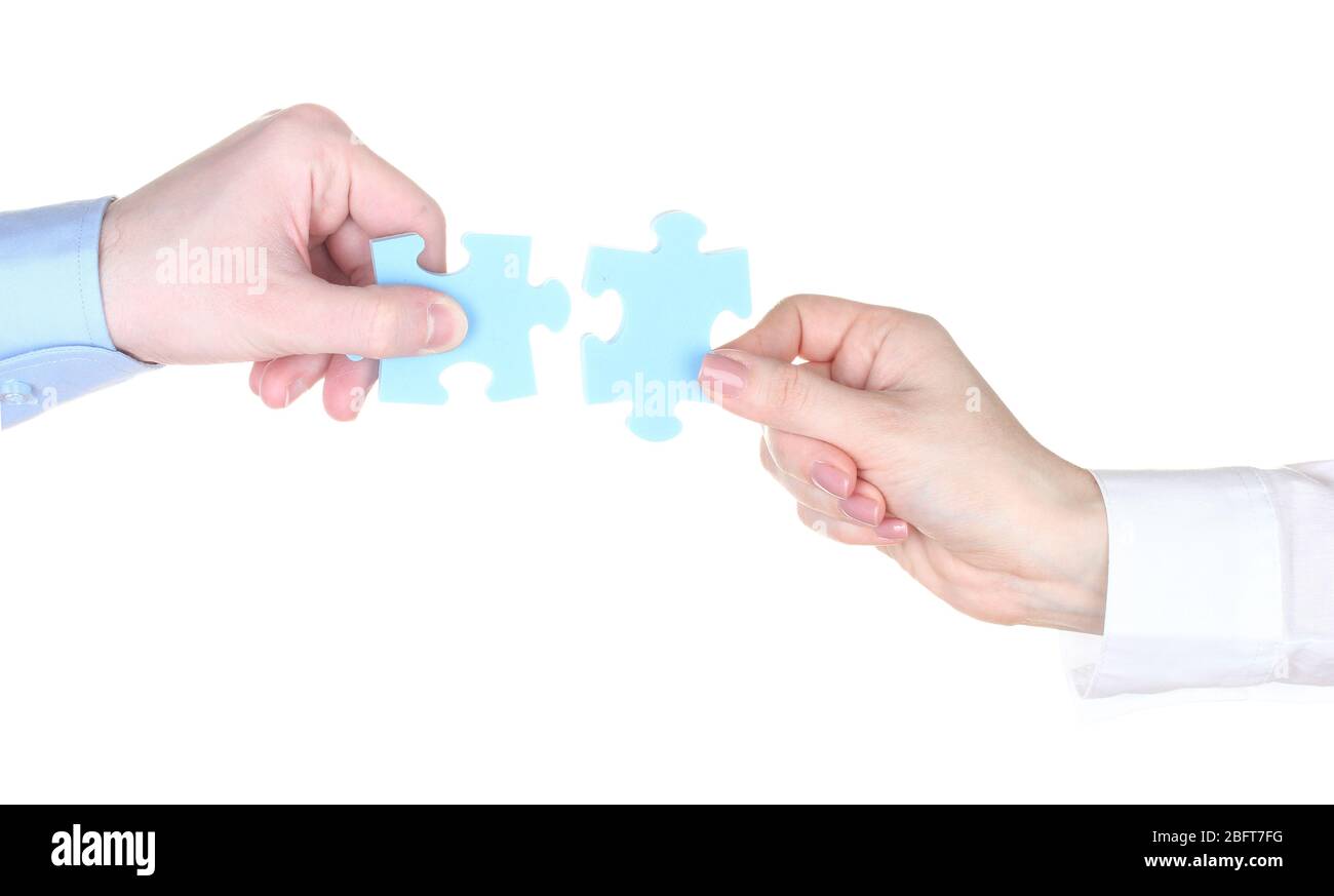 Hands with puzzle isolated on white Stock Photo - Alamy