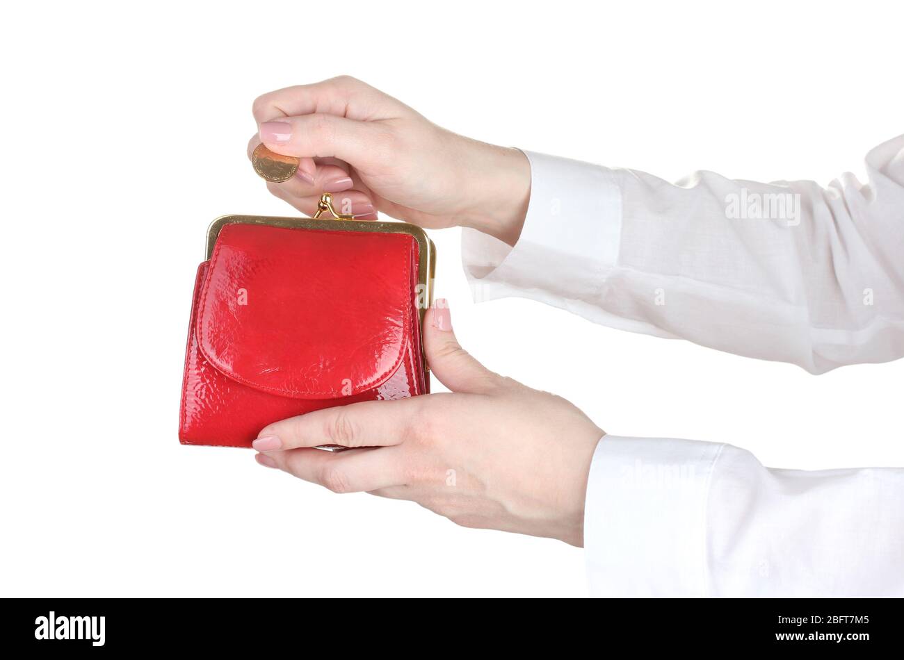woman hand throwing coin in purse isolated on white Stock Photo - Alamy