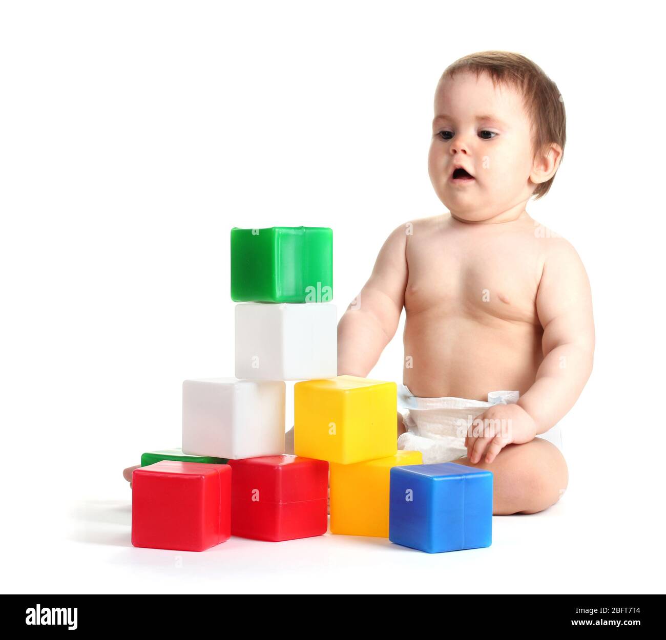 Cute baby girl playing with cubes isolated on white Stock Photo - Alamy
