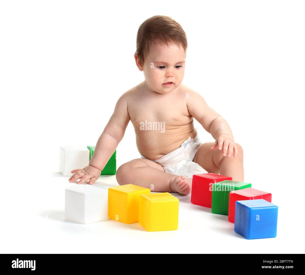 Cute baby girl playing with cubes isolated on white Stock Photo - Alamy