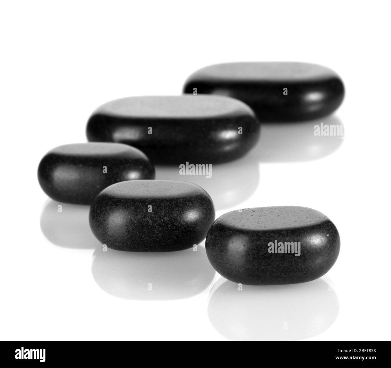 Spa stones isolated on white Stock Photo - Alamy