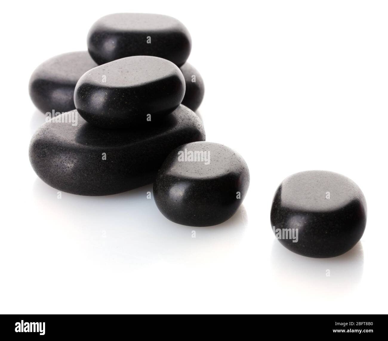 Spa stones isolated on white Stock Photo - Alamy
