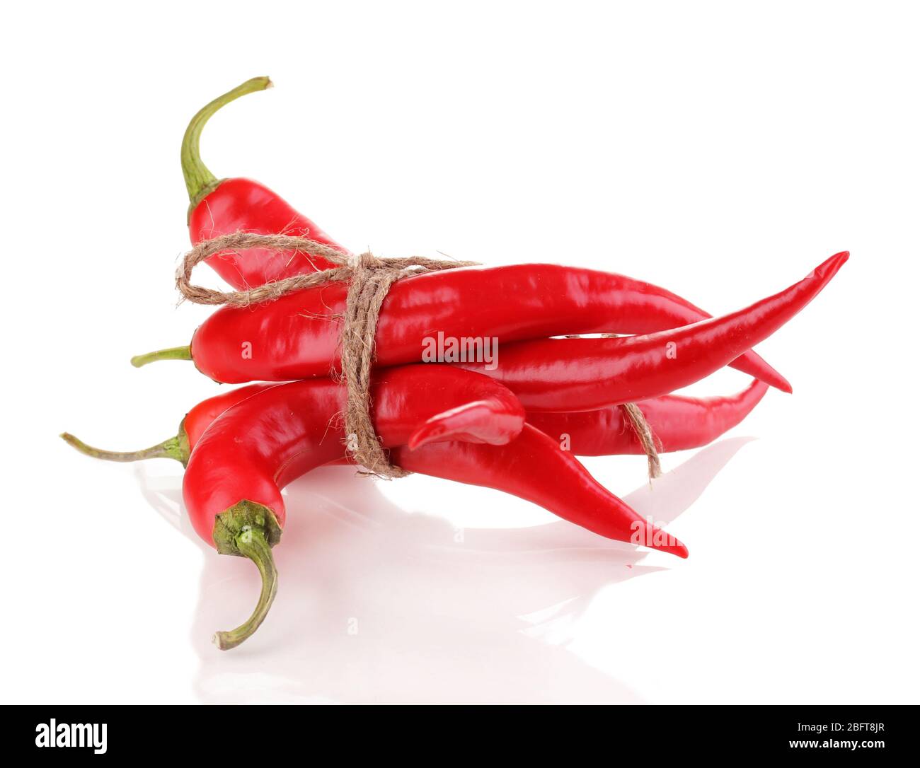 Red hot chili peppers tied with rope isolated on white Stock Photo - Alamy