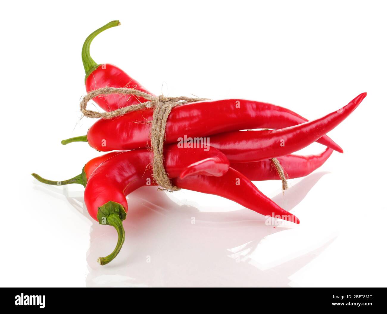Red hot chili peppers tied with rope isolated on white Stock Photo - Alamy
