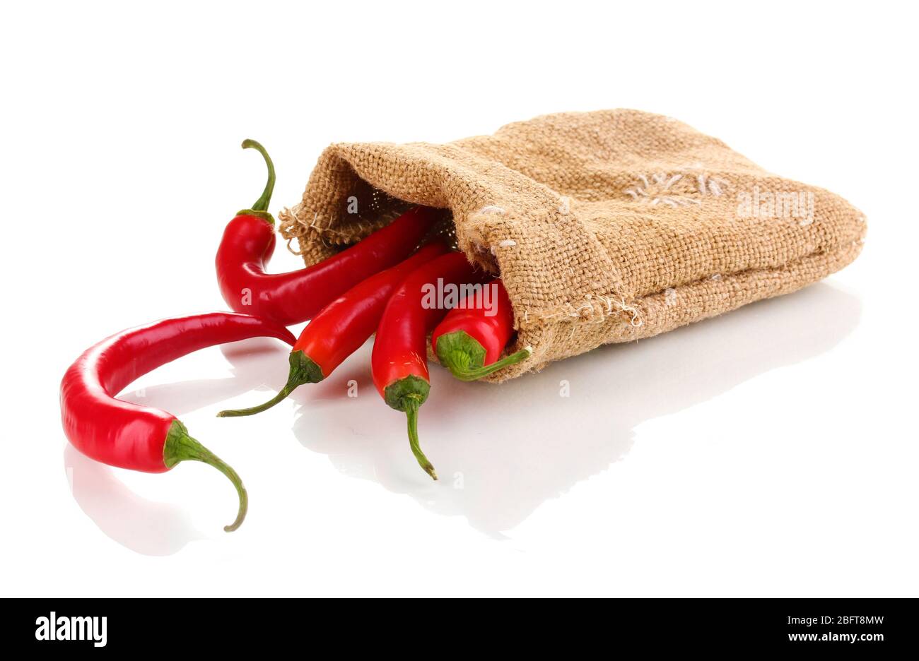 Red hot chili peppers in bag isolated on white Stock Photo - Alamy
