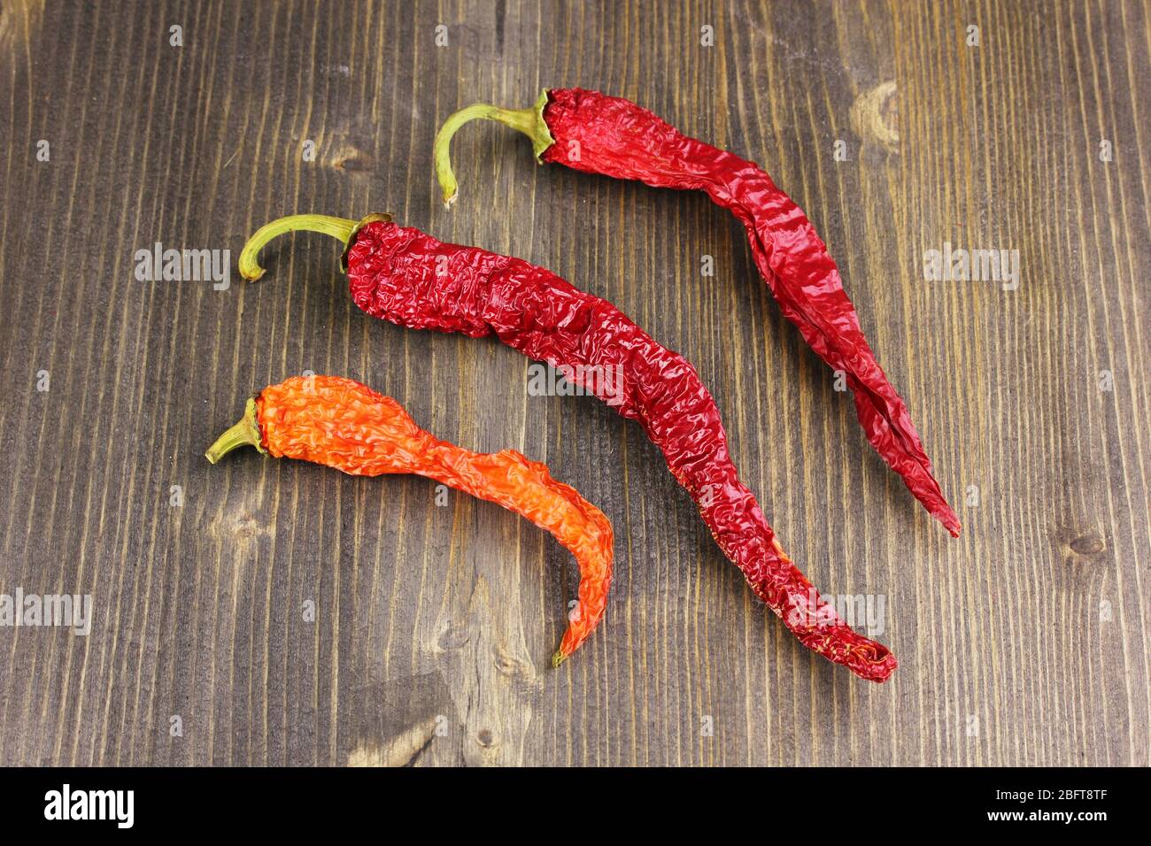 Three dried spicy peppers hi-res stock photography and images - Alamy