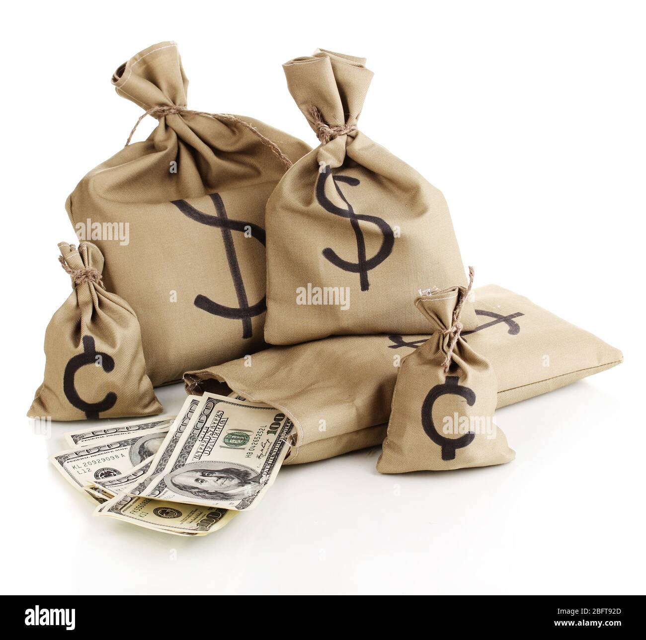 Bags with money isolated on white Stock Photo - Alamy