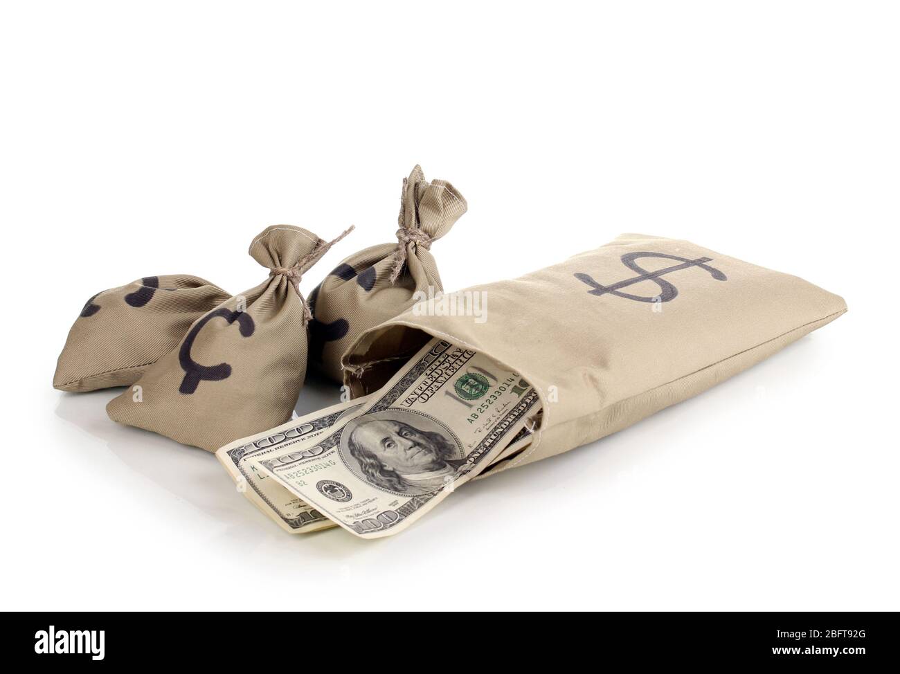 Bags with money isolated on white Stock Photo - Alamy