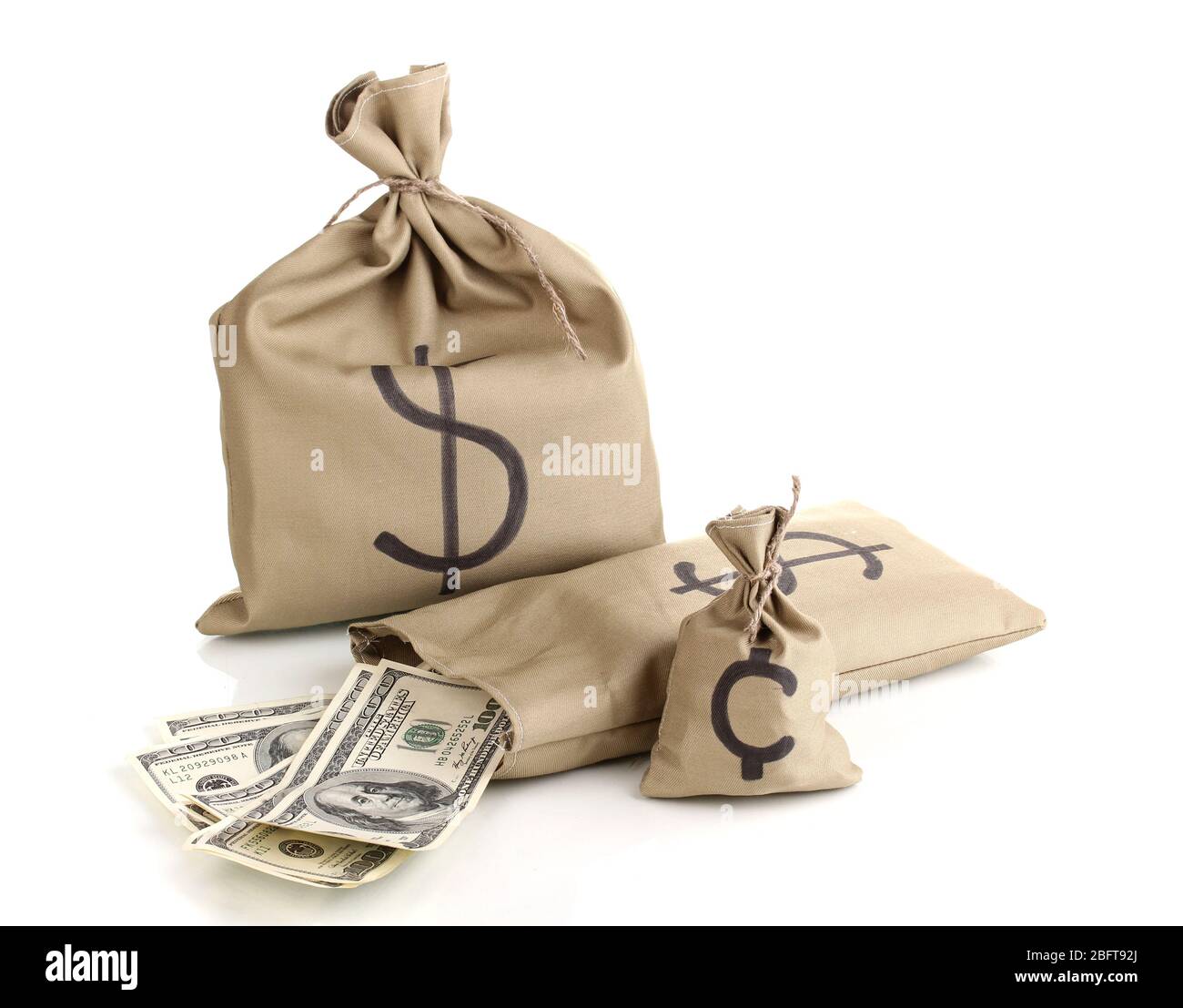 Bags with money isolated on white Stock Photo - Alamy