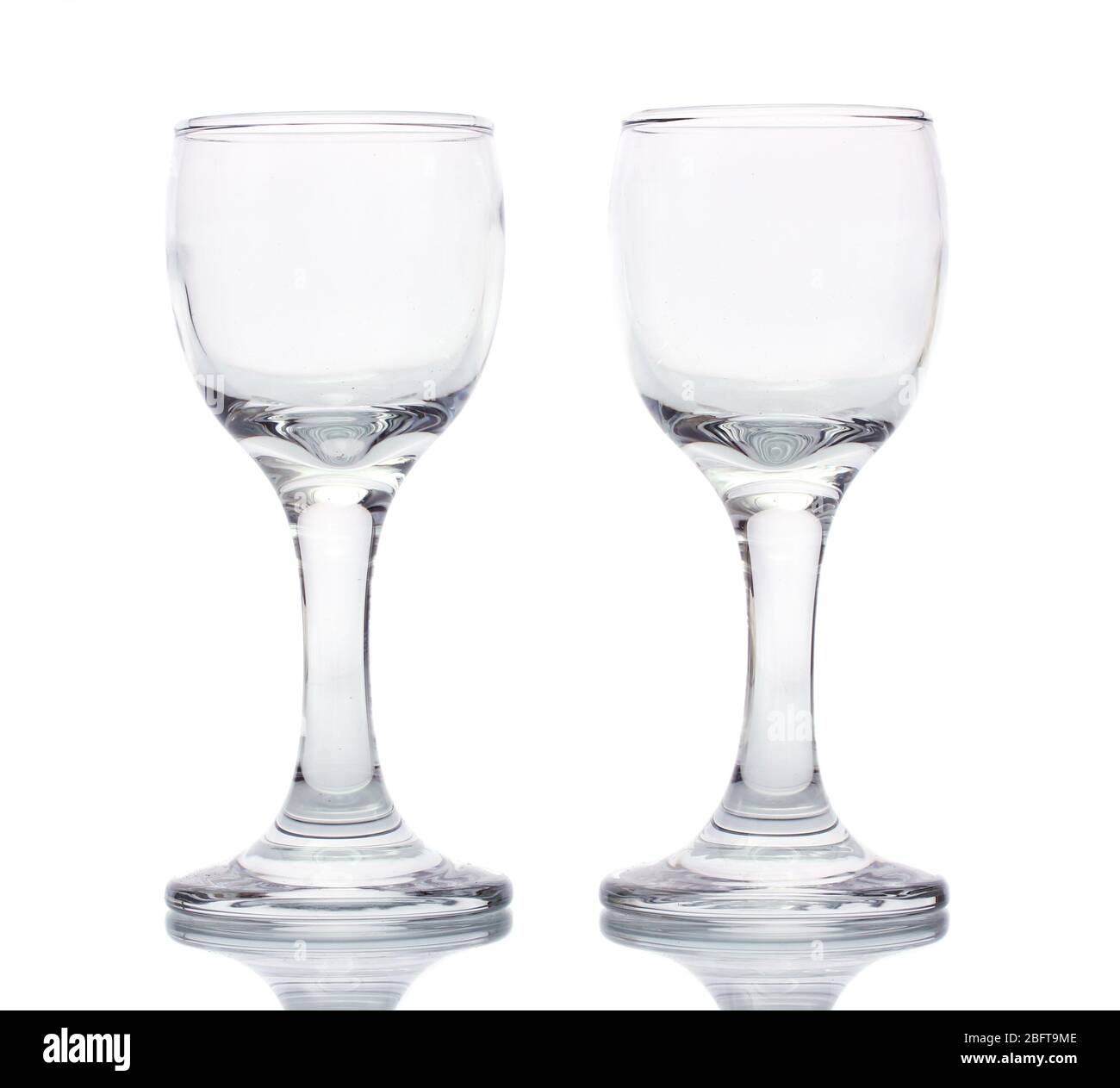 Empty glasses isolated on white Stock Photo - Alamy