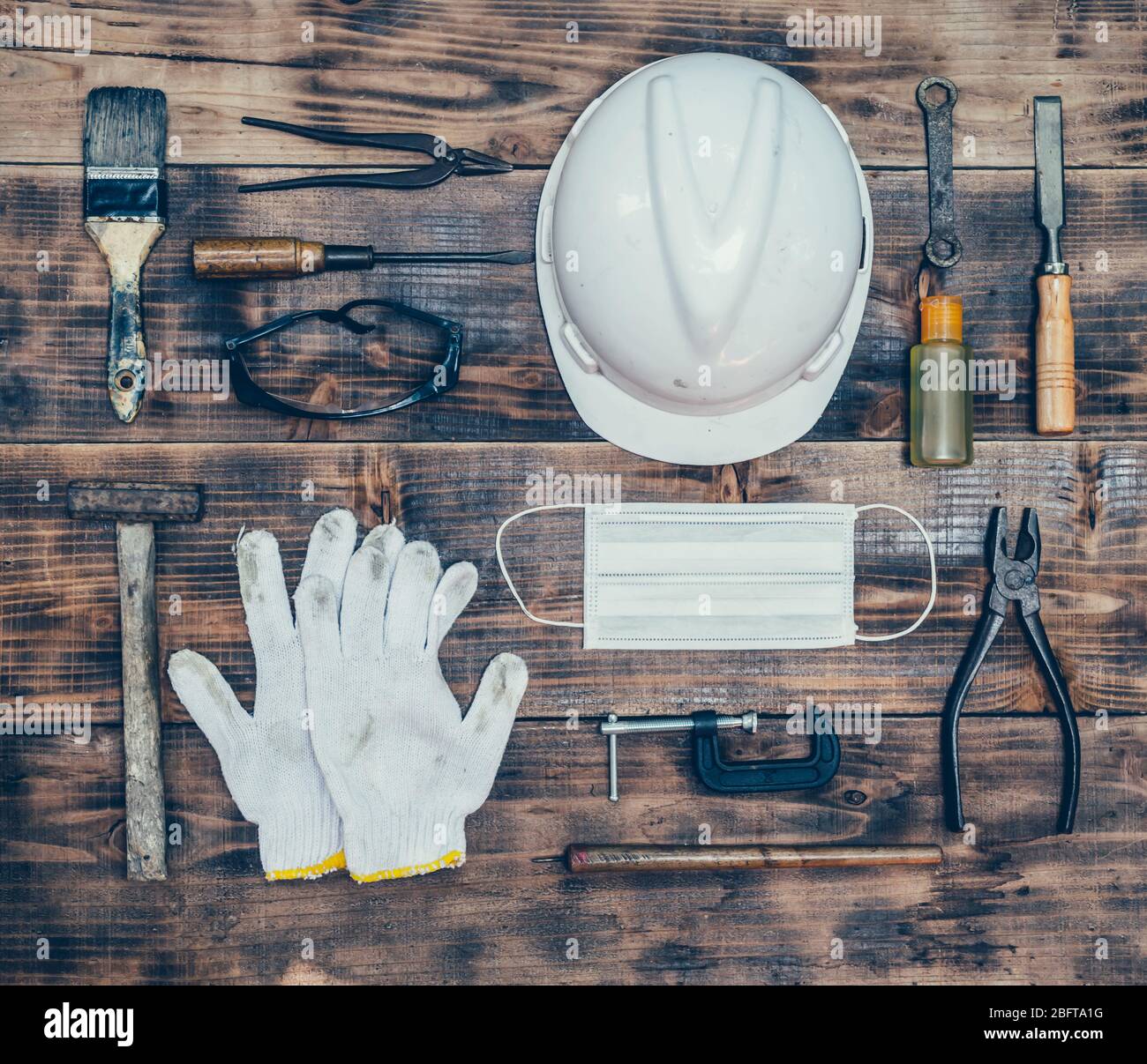 Labor day concept on wood background. Engineer and worker tools with ...