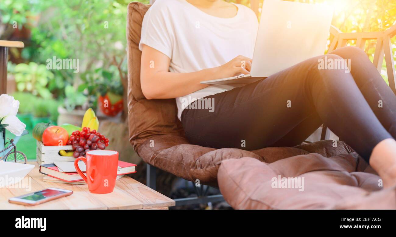 Work from home (WFH) in garden. Social Distancing and Physical ...
