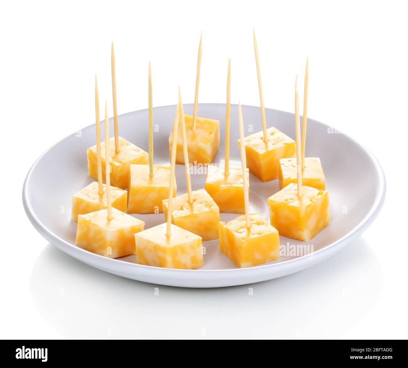 Cheese canapes on plate isolated on white Stock Photo - Alamy