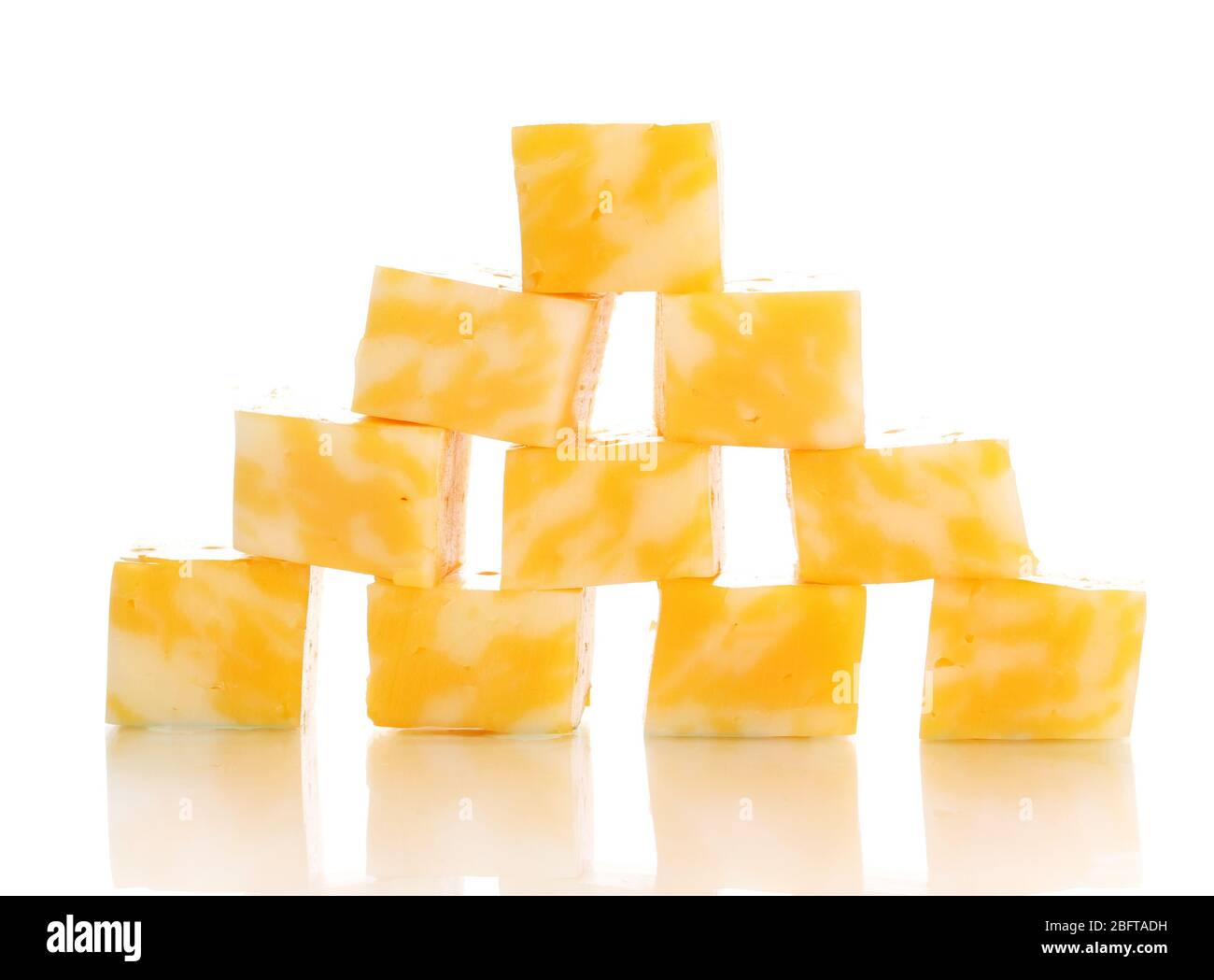 Cheese pyramid isolated on white Stock Photo - Alamy
