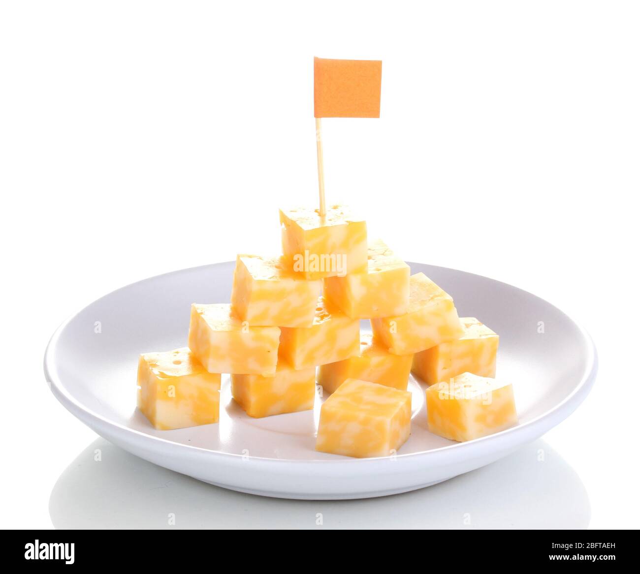 Cheese pyramid on plate isolated on white Stock Photo - Alamy