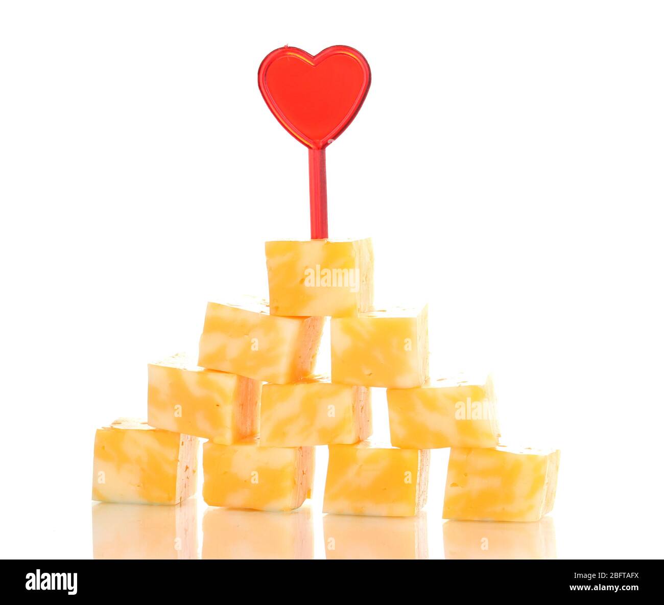 Cheese pyramid isolated on white Stock Photo - Alamy