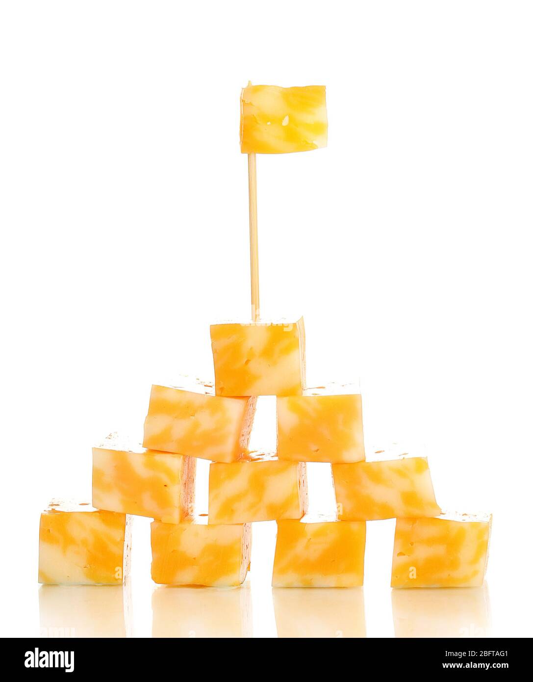 Cheese pyramid isolated on white Stock Photo - Alamy