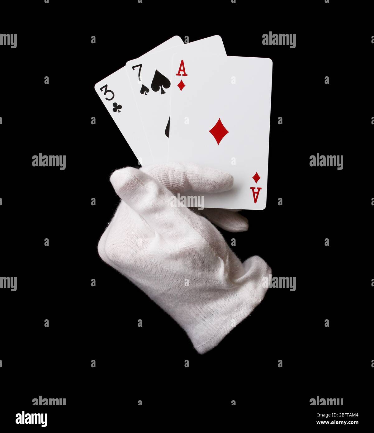 Cards in hand isolated on black Stock Photo - Alamy