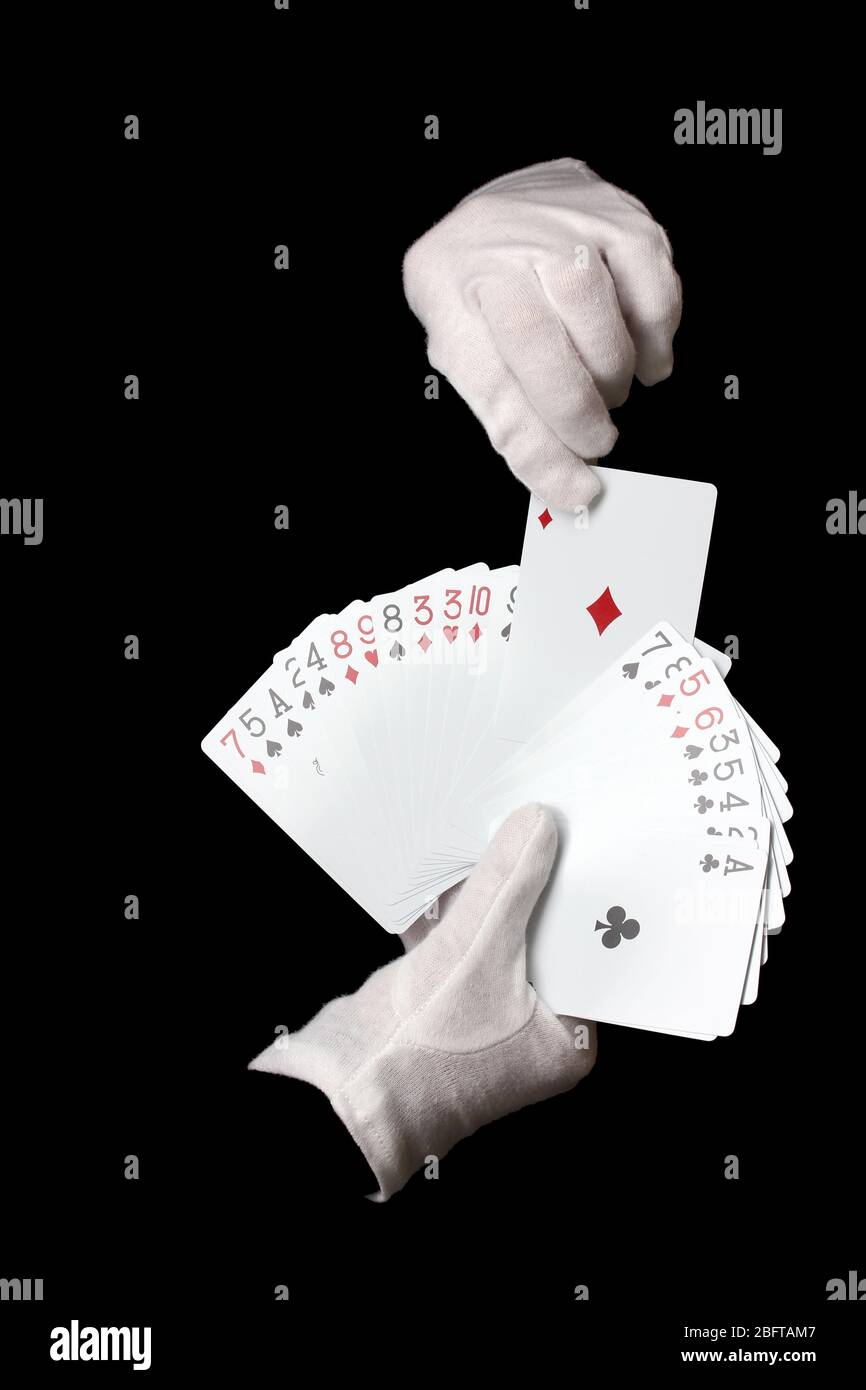 Cards in hands isolated on black Stock Photo - Alamy