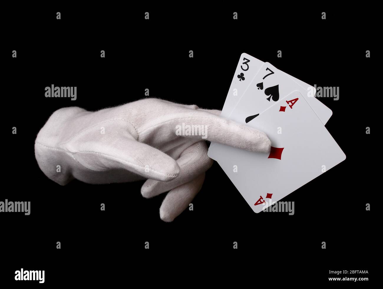 Cards in hand isolated on black Stock Photo - Alamy