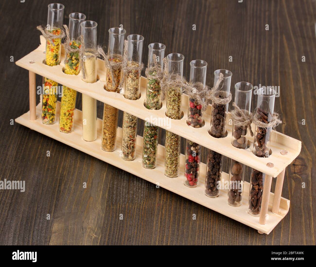 Various spices in tubes on wooden background Stock Photo - Alamy