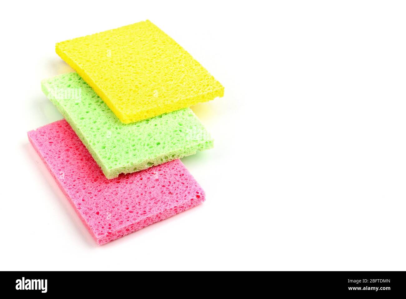 Cellulose sponges isolated on white Stock Photo - Alamy