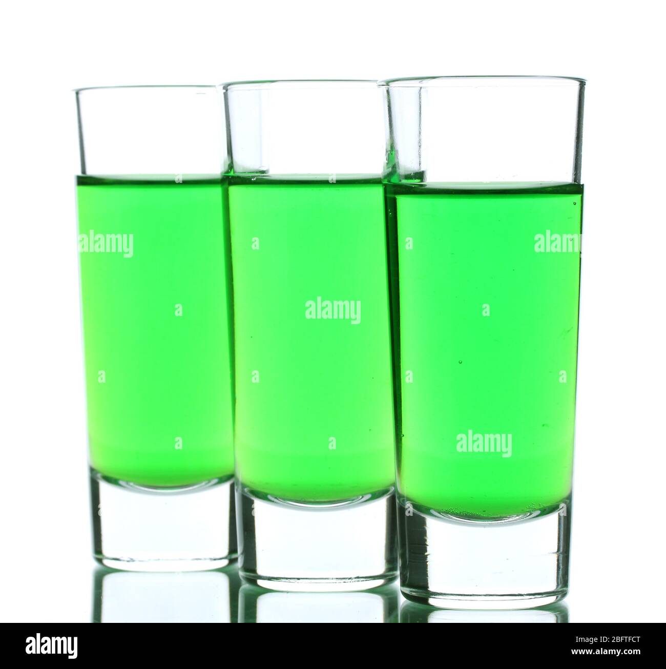 three glasses of absinthe isolated on white Stock Photo - Alamy