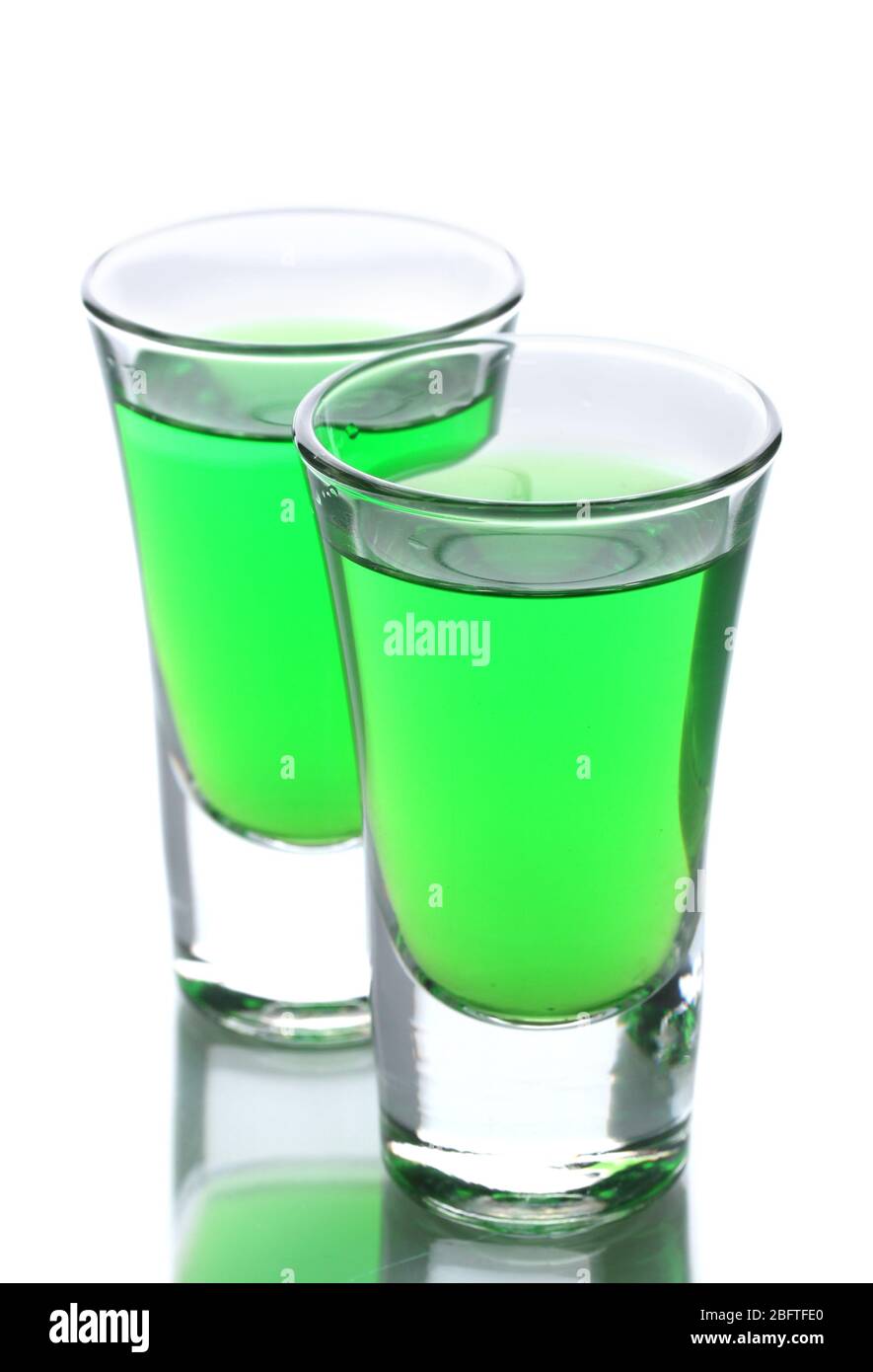 Two glasses of absinthe isolated on white Stock Photo - Alamy
