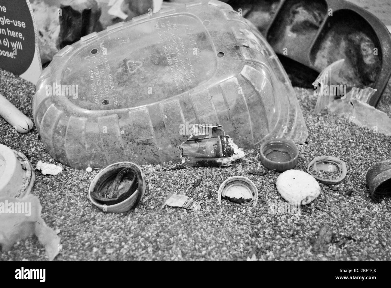 Plastic litter in black and white Stock Photo - Alamy