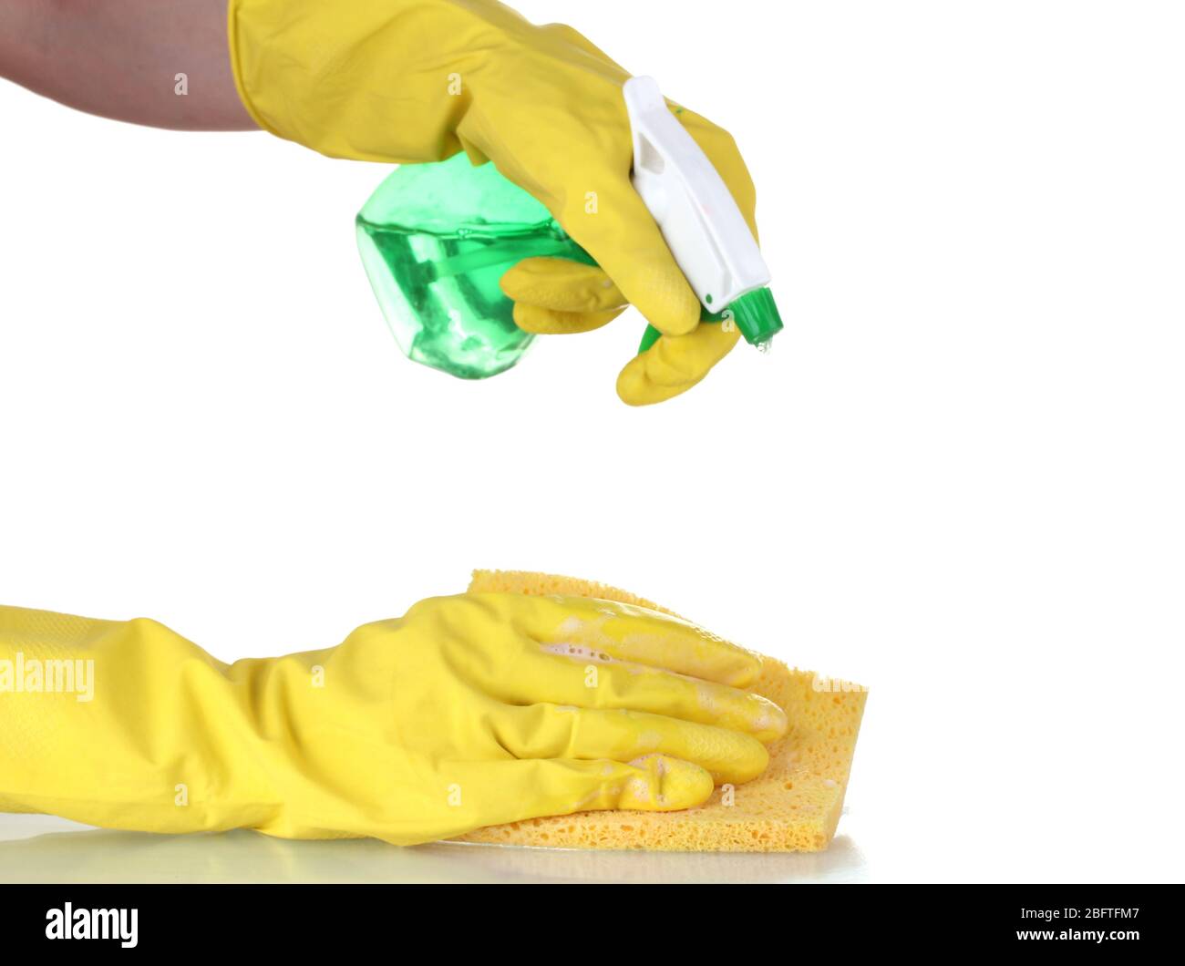 Cleaning surface in bright yellow gloves with sponge and cleaning ...