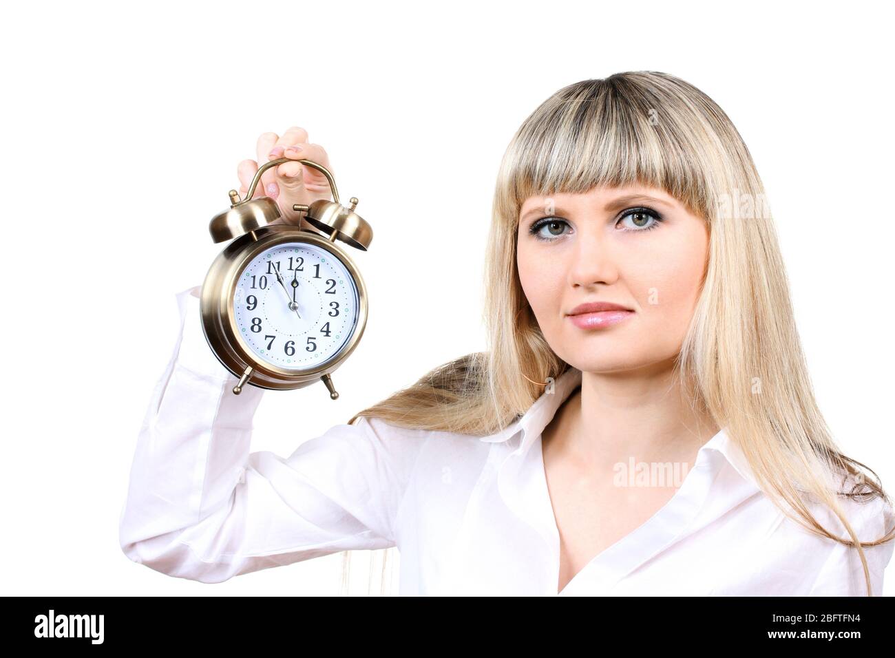 Young business woman holding clock isolated on white Stock Photo - Alamy