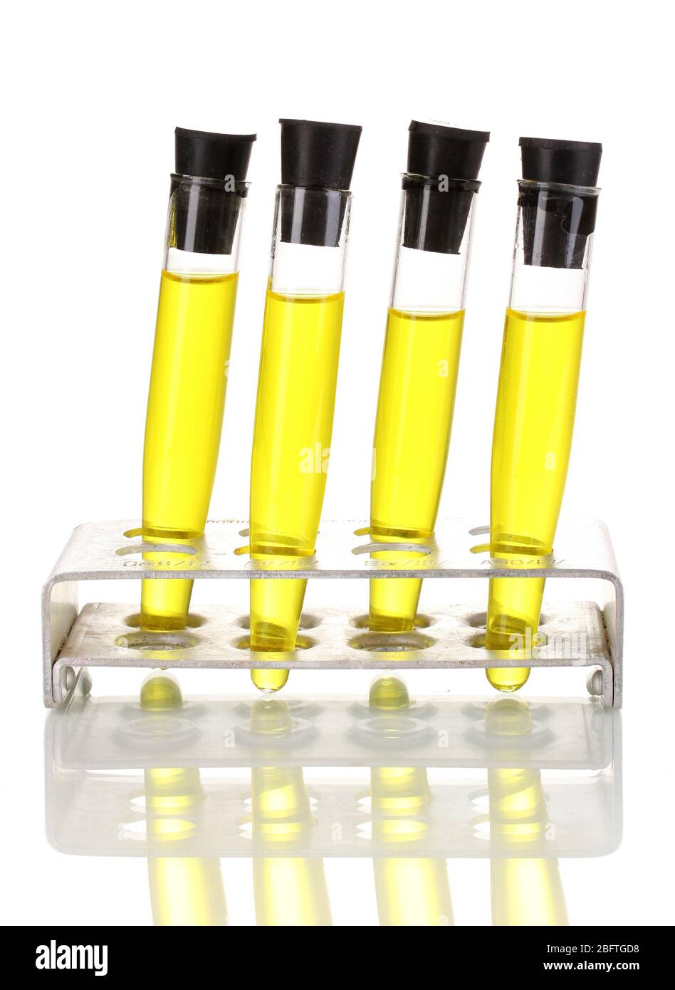 Test-tubes with yellow liquid isolated on white Stock Photo - Alamy
