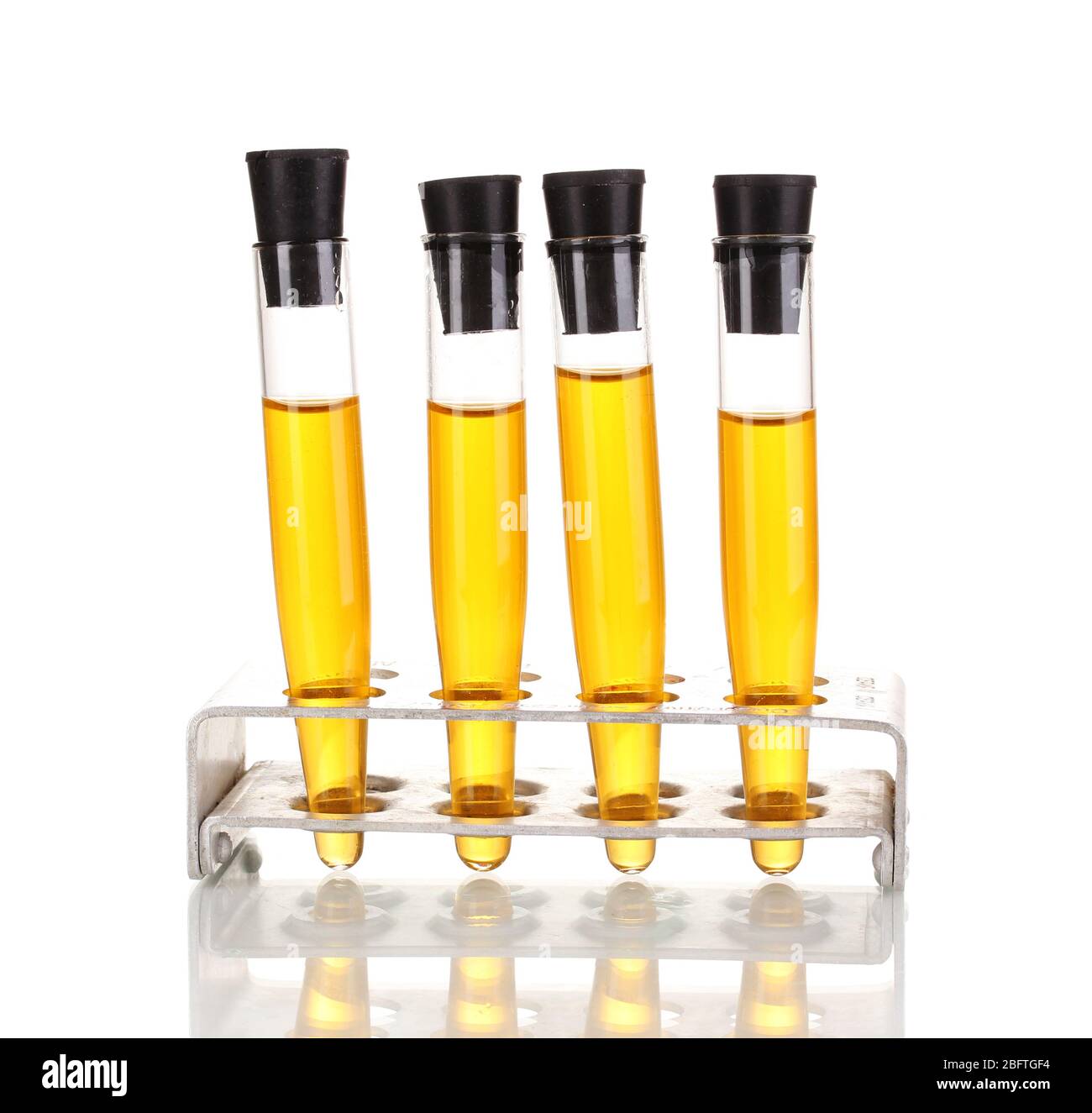 Test-tubes with yellow liquid isolated on white Stock Photo - Alamy