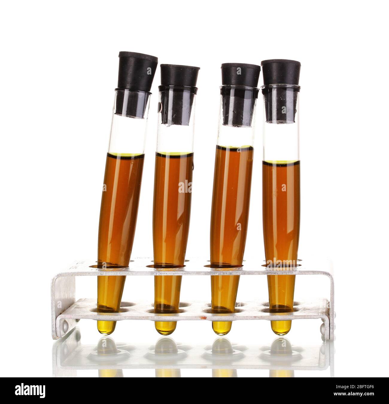 Test-tubes with brown liquid isolated on white Stock Photo - Alamy