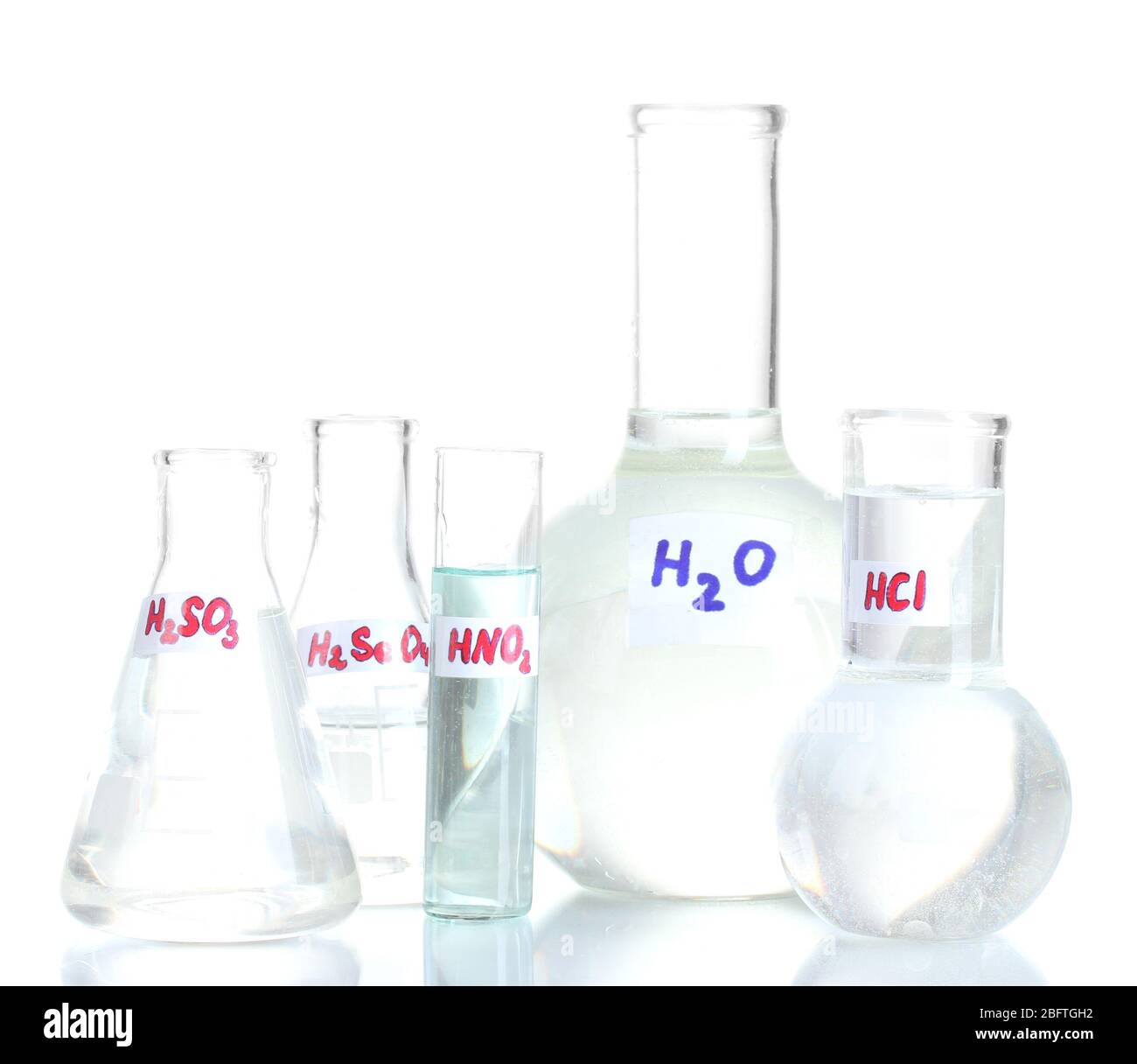 Test-tubes with various acids isolated on white Stock Photo - Alamy