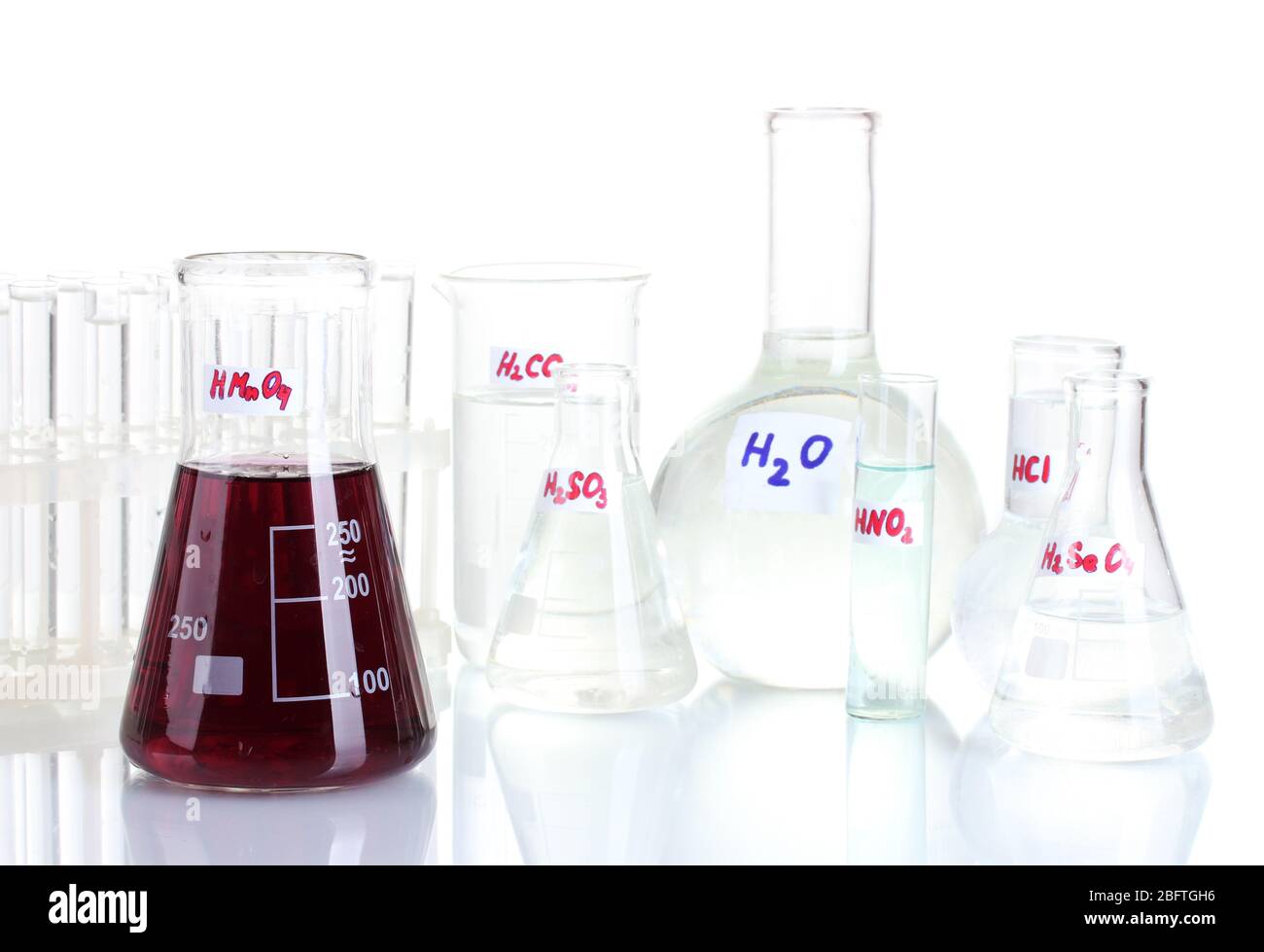 Test-tubes with various acids isolated on white Stock Photo - Alamy
